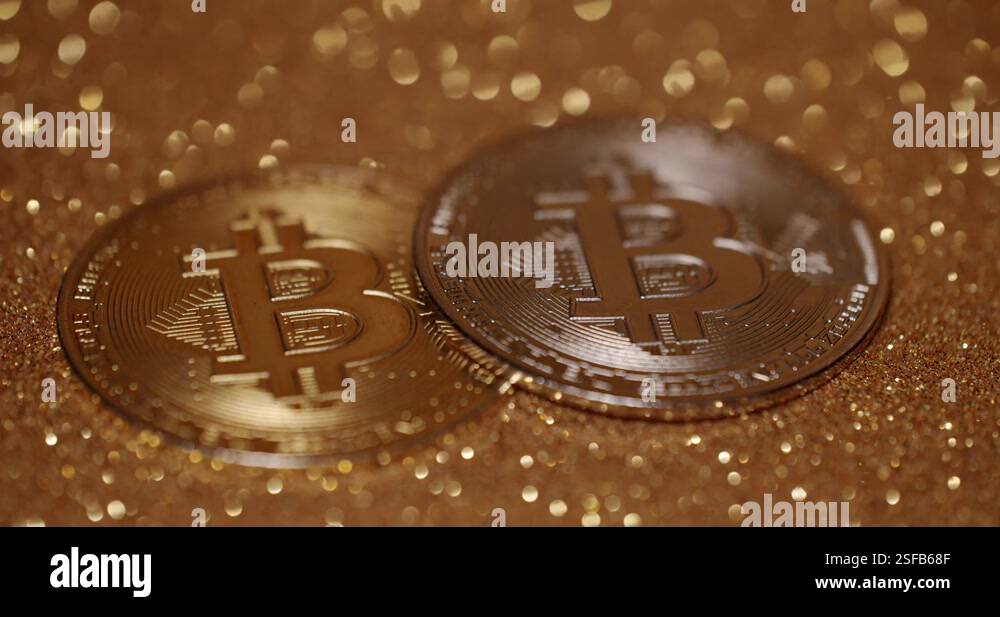 Bitcoin BTC coin. New virtual currency. Close Up on gold background ...