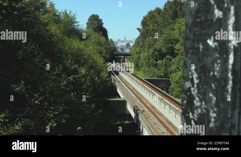 Time lapse of light rail train tracks with trains travelling back and ...