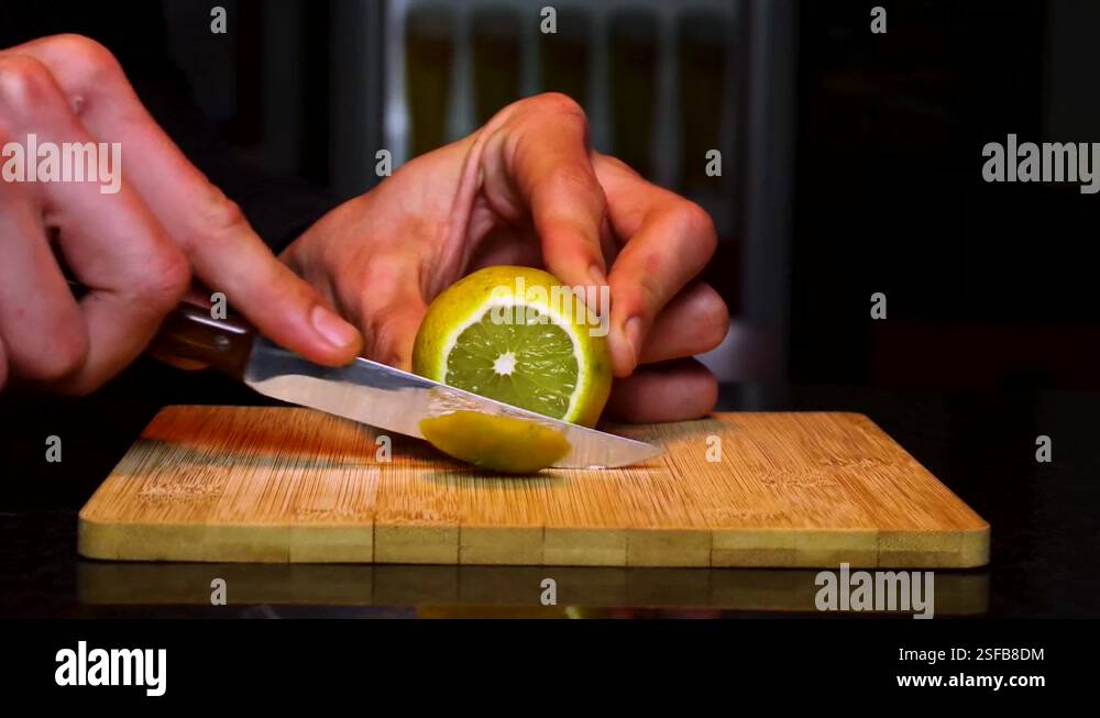 Cutting a lime in 4k. Green fresh lime being cut in slices Stock Video ...