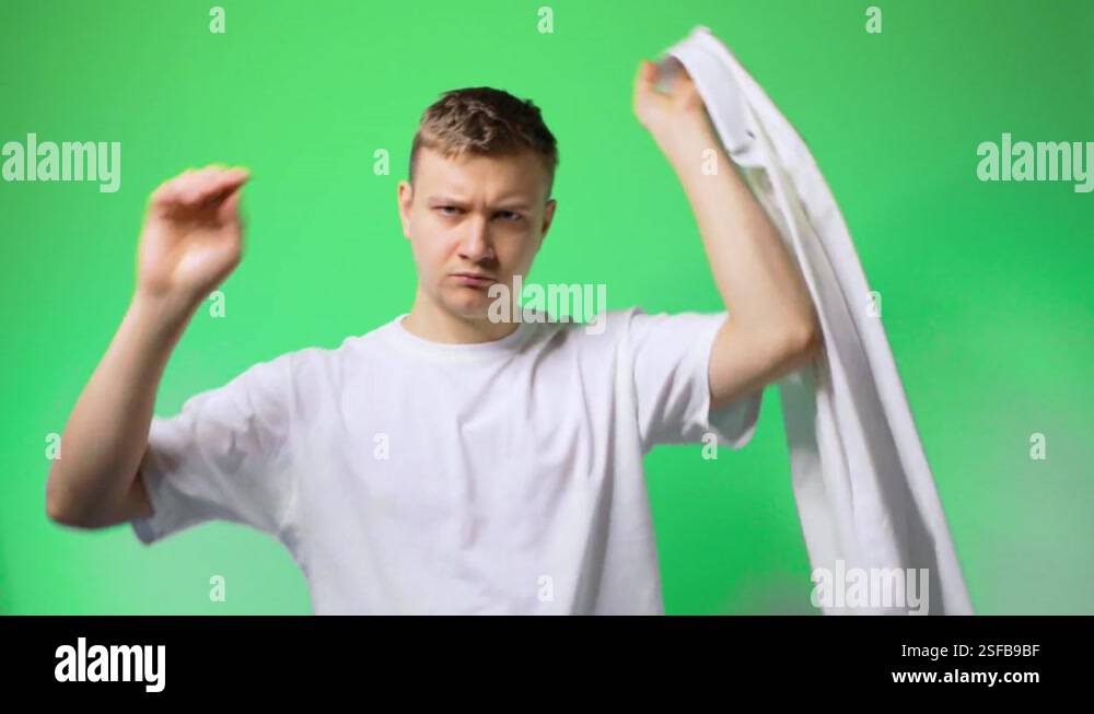 young man irons a shirt serious independent chroma key Stock Video ...