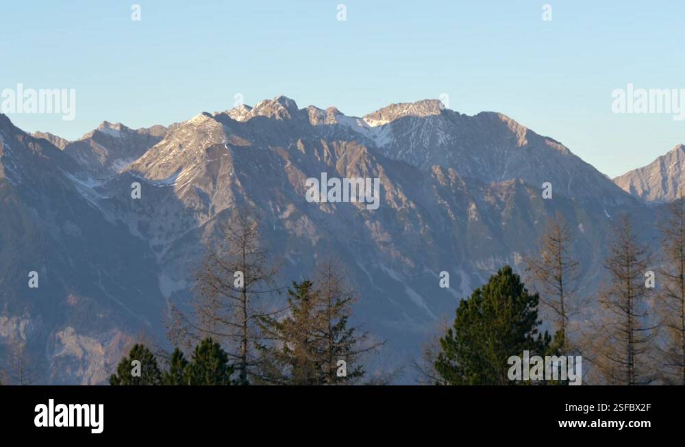 Idyllic scene with mountain in golden hour, Inn Valley, Austria. Slow ...