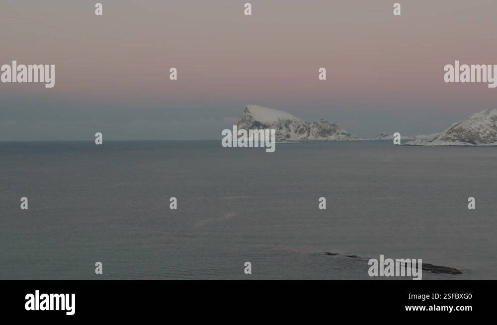 Snowy Unpopulated Haja Island With Dusk Gradient Sky In Norwegian Sea ...
