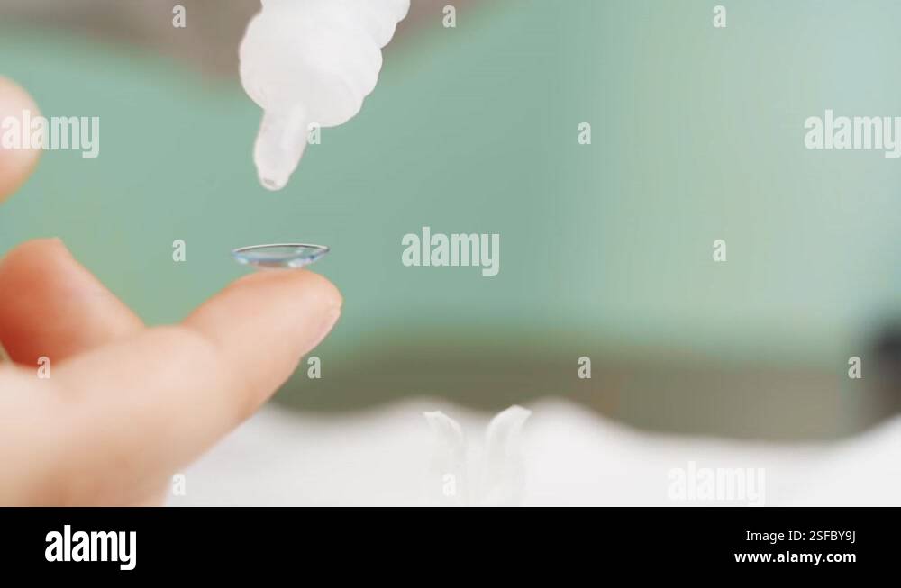 close-up. on contact lens on a child's finger drip eye drops Stock ...