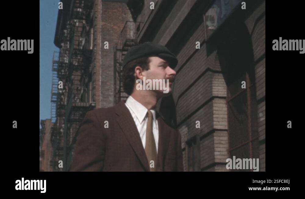 1960s: Text on chalkboard. Man standing outside building. Man walking ...