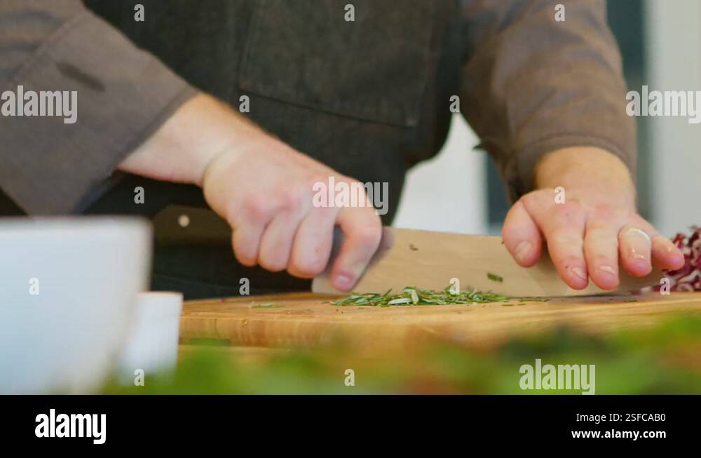 A chef chopping vegetables with a sharp knife, static close up Stock ...