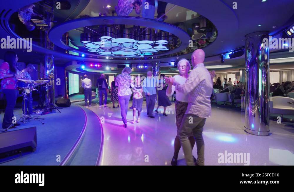 4k, passengers dancing in a night bar on the deck of a cruise ship MSC ...