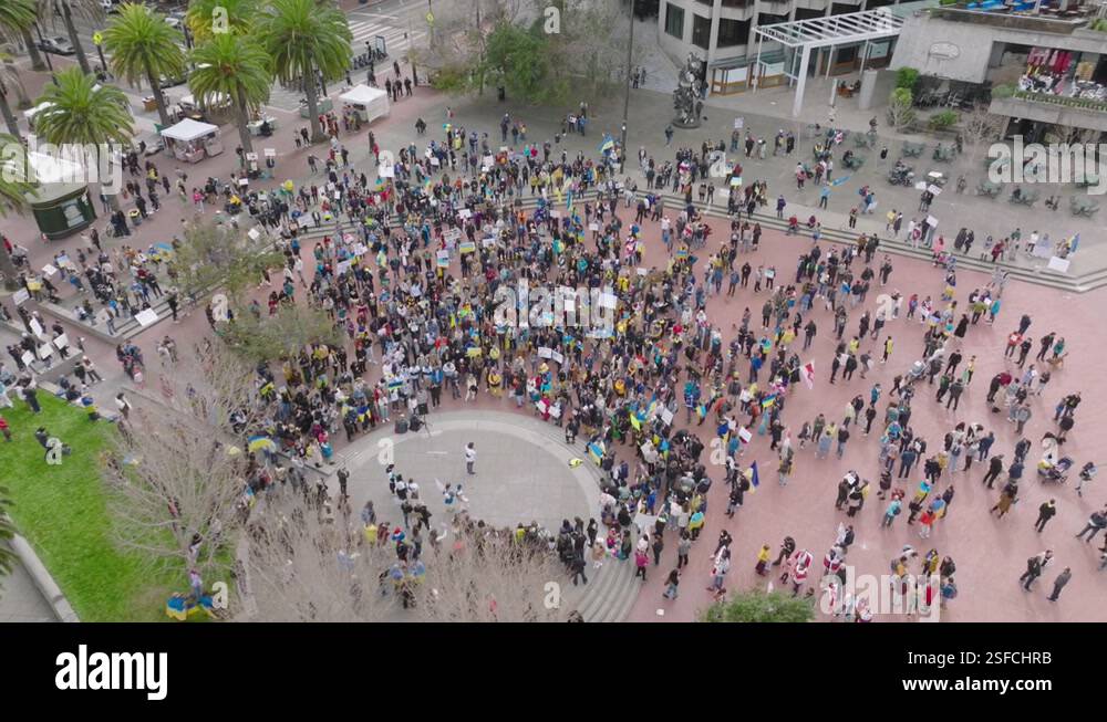Crowd people with yellow blue Ukrainian flags and STOP WAR signs, San ...
