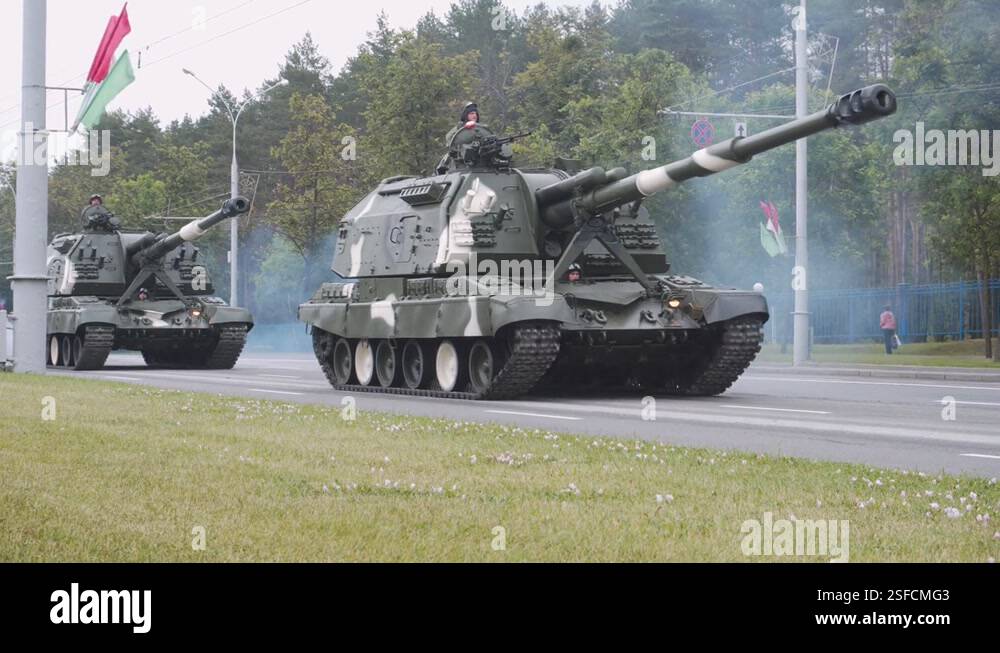 Column of military self-propelled howitzers Msta S moves along green street Stock Video Footage ...