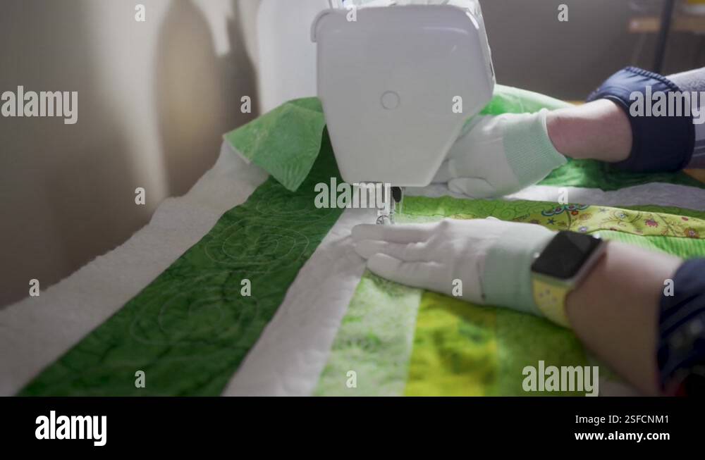 Sewing in a stitch pattern through all the layers of a patchwork log ...