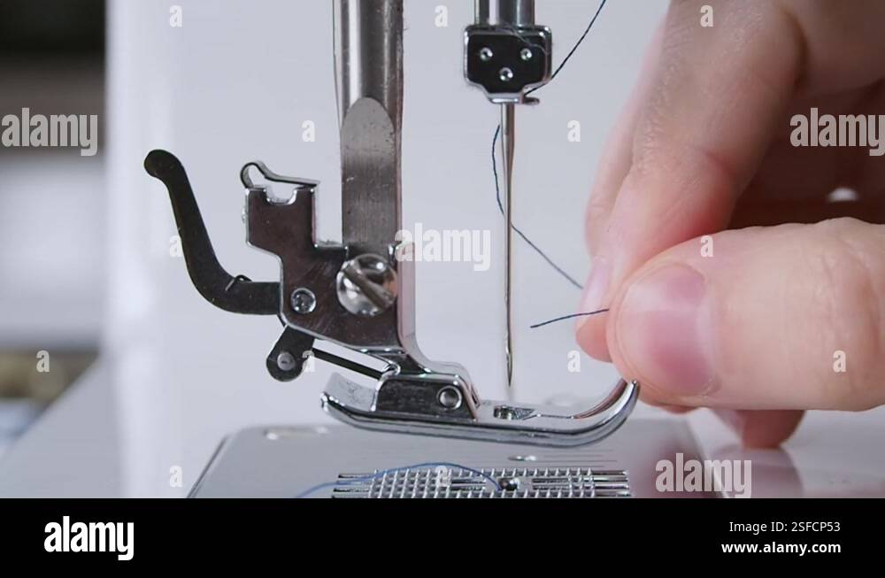 Sewing beginner struggling to put the thread into the sewing machine ...