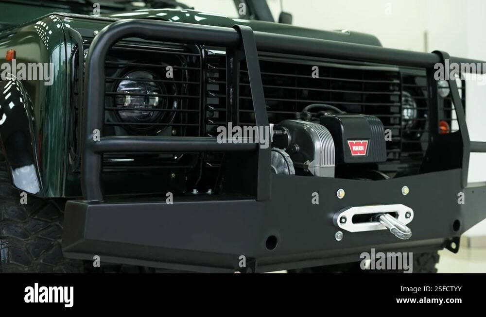 warn winch front winch for land rover defender classic moss green 110 Stock Video Footage - Alamy