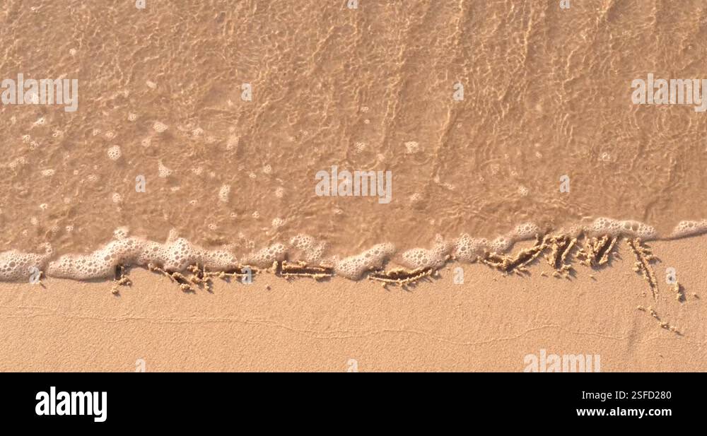 Freedom word on the sand Stock Video Footage - Alamy