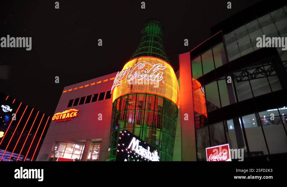 Driving on Las Vegas Strip at Night. Glowing Coca Cola Logo and Bottle ...