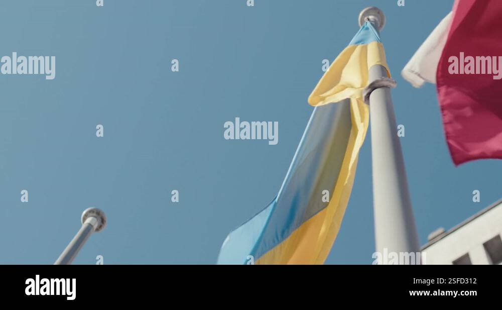 Ukrainian flag wave flutter flaps Russian on a windy Ukraine war day ...