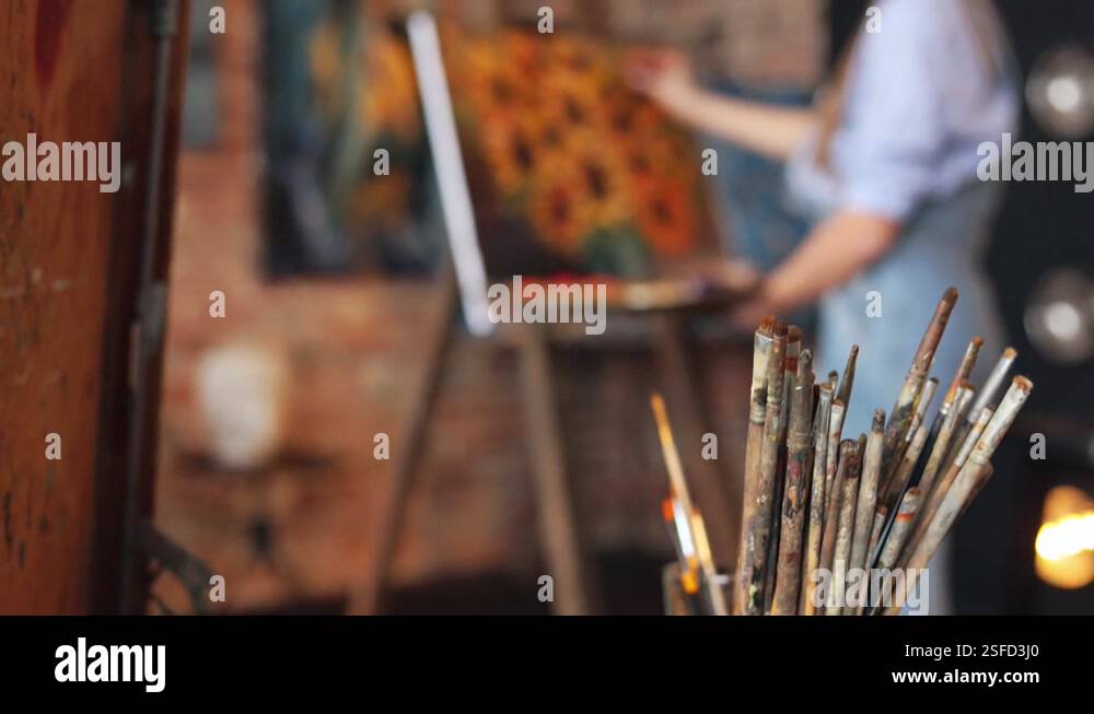 Working process in art studio. Set of painting brushes and palette ...