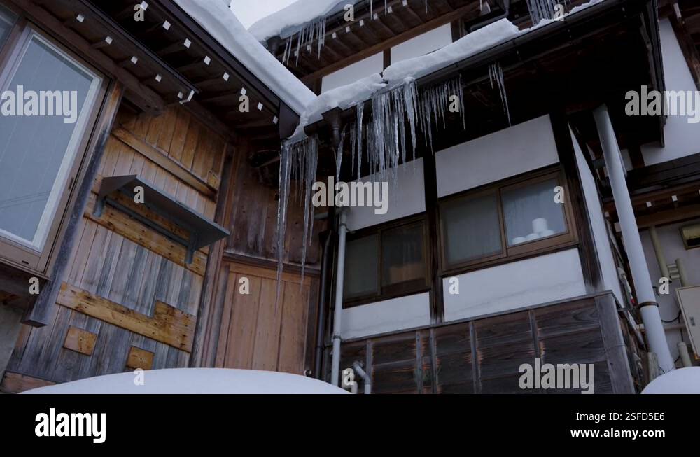 Icicles hanging from Ryokan, snow on roof in winter, Shibu Onsen Japan ...