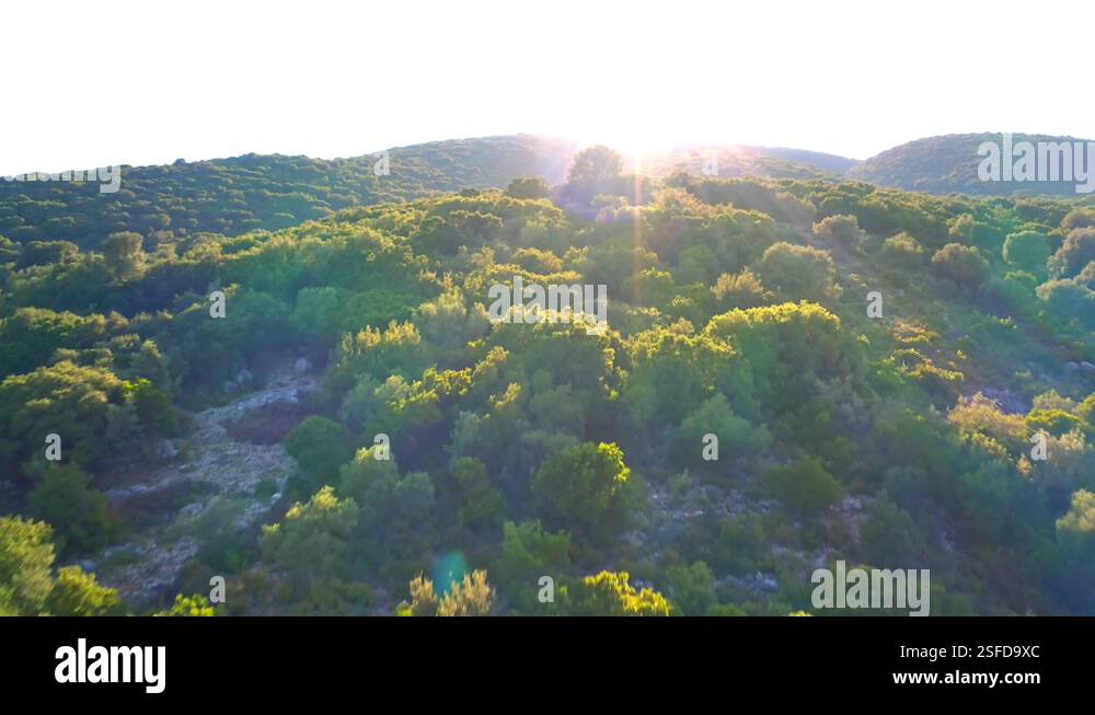 Greece nature aerial. Sunshine over mountain, bright sun light rays and ...