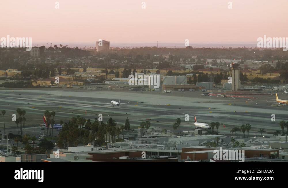 Footage of a landing plane with urban skyline in the background Stock ...
