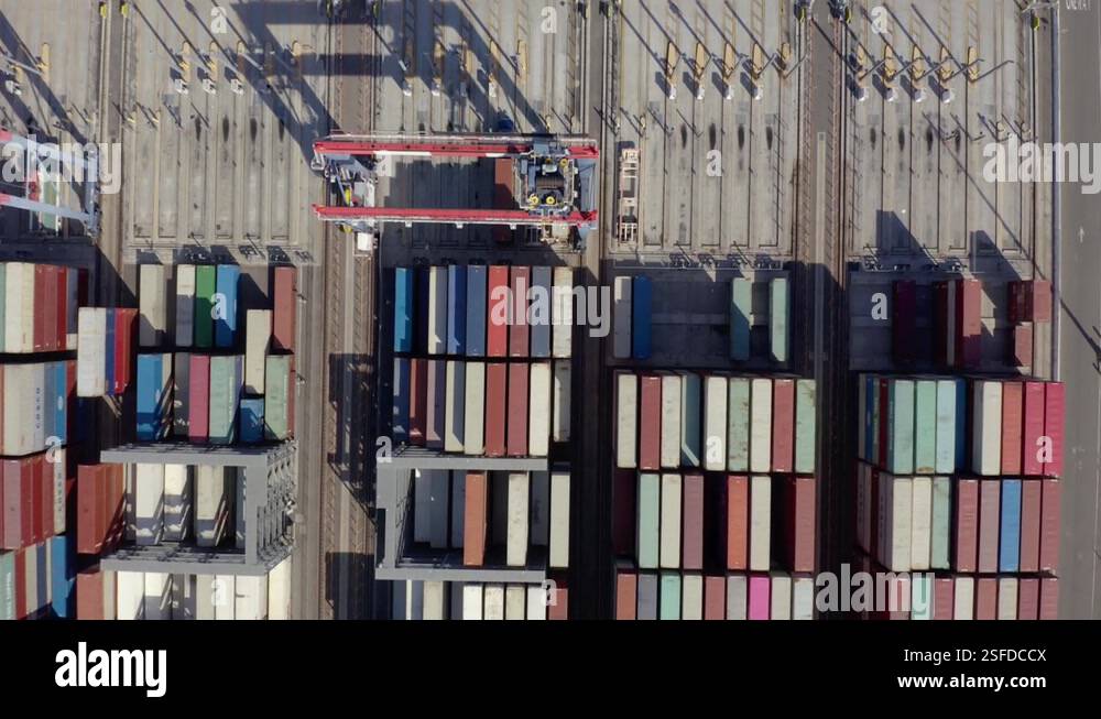 Flying above railroad station with cargo trains and freight containers ...