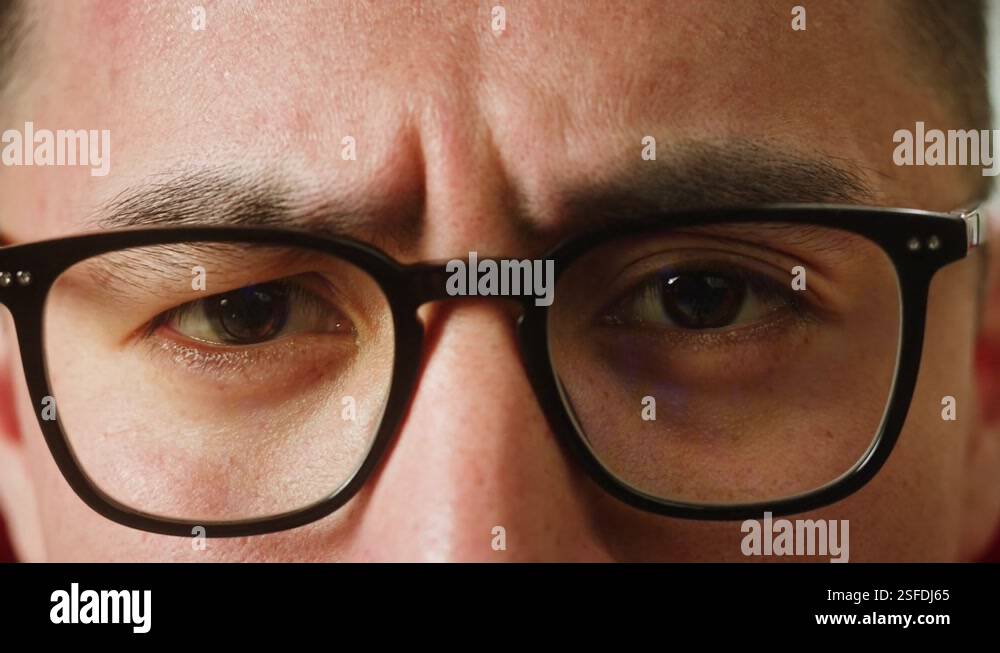 Asian angry man eyes close-up. Korean young guy wearing glasses ...