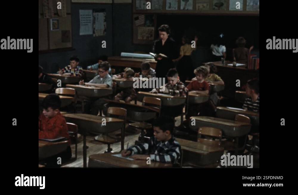 1950s: kids and teacher walk in line in classroom, kids at desks and ...