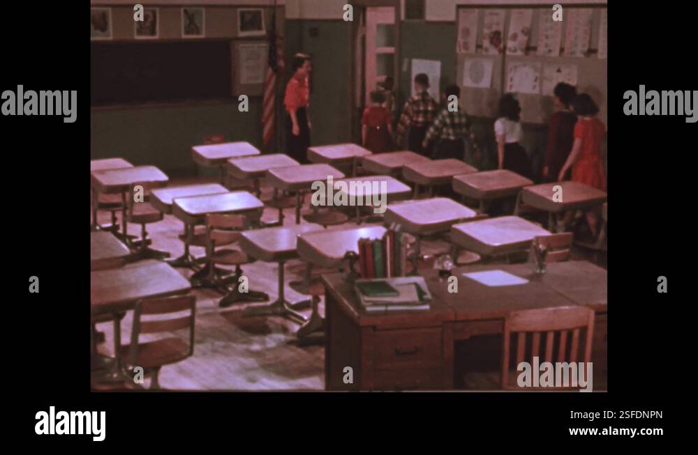 1950s: children exit classroom in single file line, children write on ...