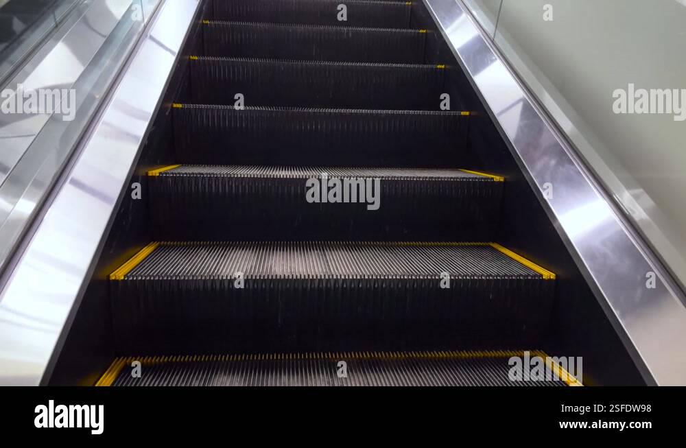 Moving escalator Stock Video Footage - Alamy
