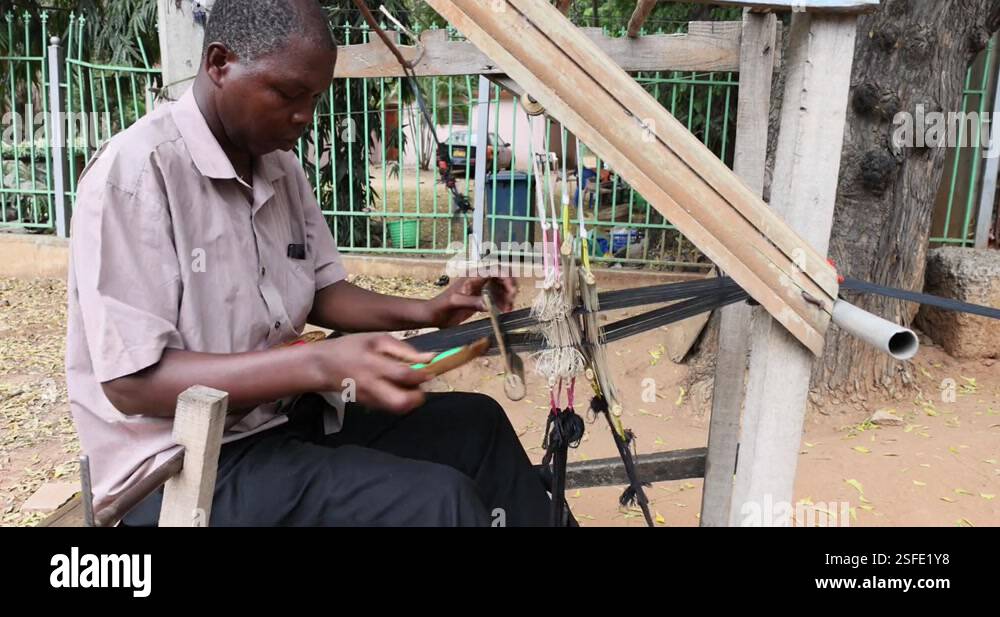 Man work loom making Kente cloth fabric Accra Ghana 4K Stock Video ...