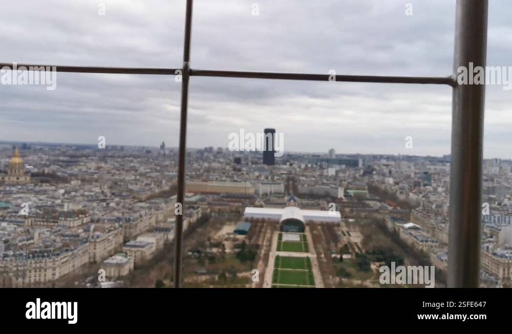 A telescope at the very top of the eithel tower looking down at paris ...