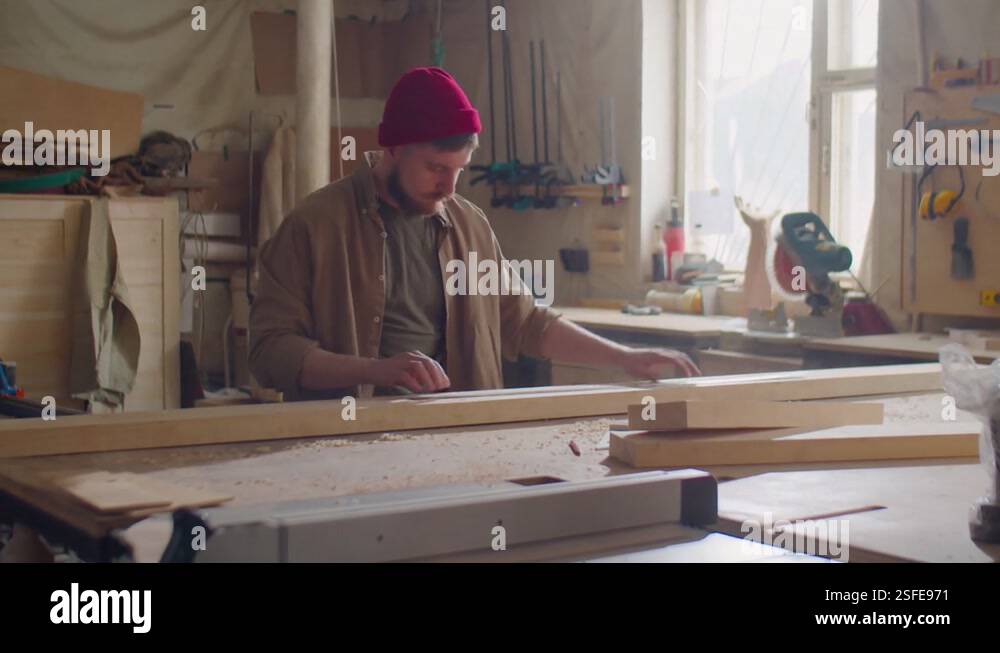 Carpenter Using Ruler and Pencil while Working with Wooden Plank Stock ...