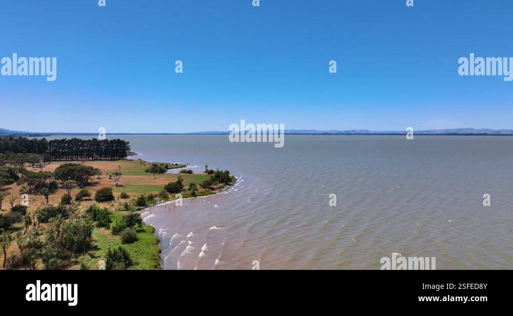 Fly the shoreline of Lake Wairarapa sun-drenched wind swept - New ...