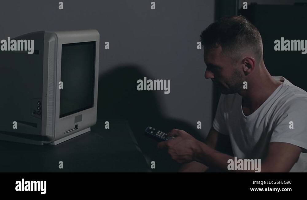 Mind Control - Zombified Man in White T-shirt Switches Channels on the ...