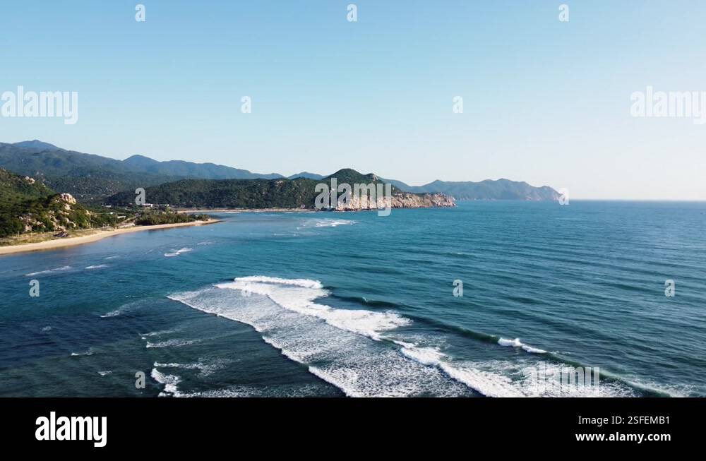 Calm waves on paradise tropical coast in Hang Rai, Vietnam, aerial view ...