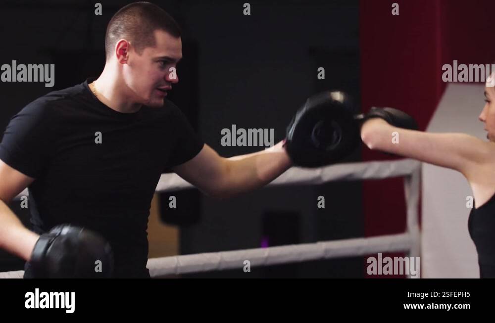 Young woman with long hair training boxing with her Stock Video Footage ...