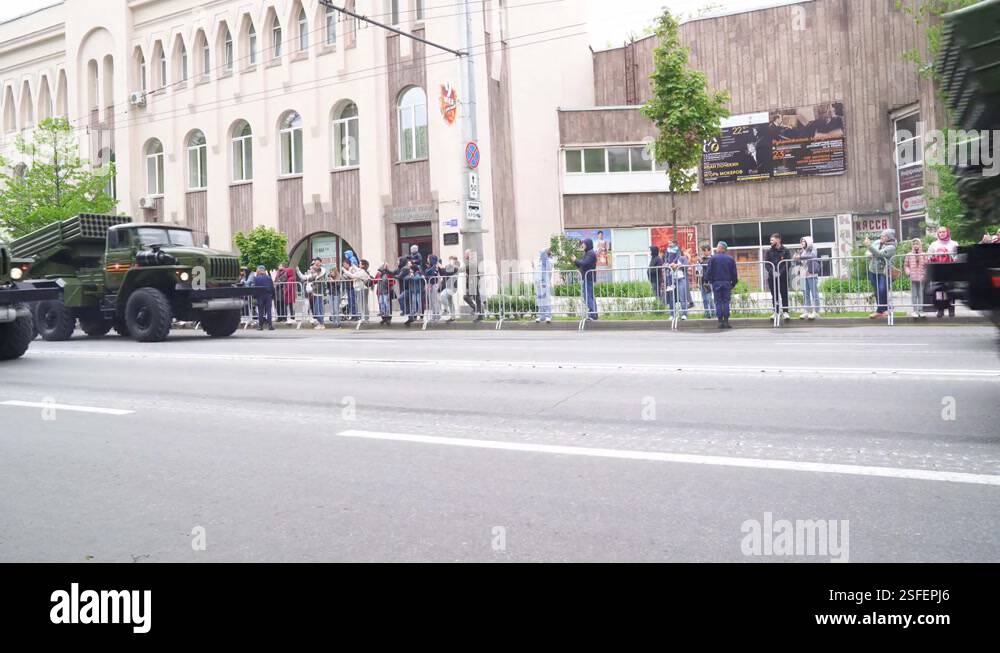 Tornado-G multiple rocket launchers drives through streets of city ...