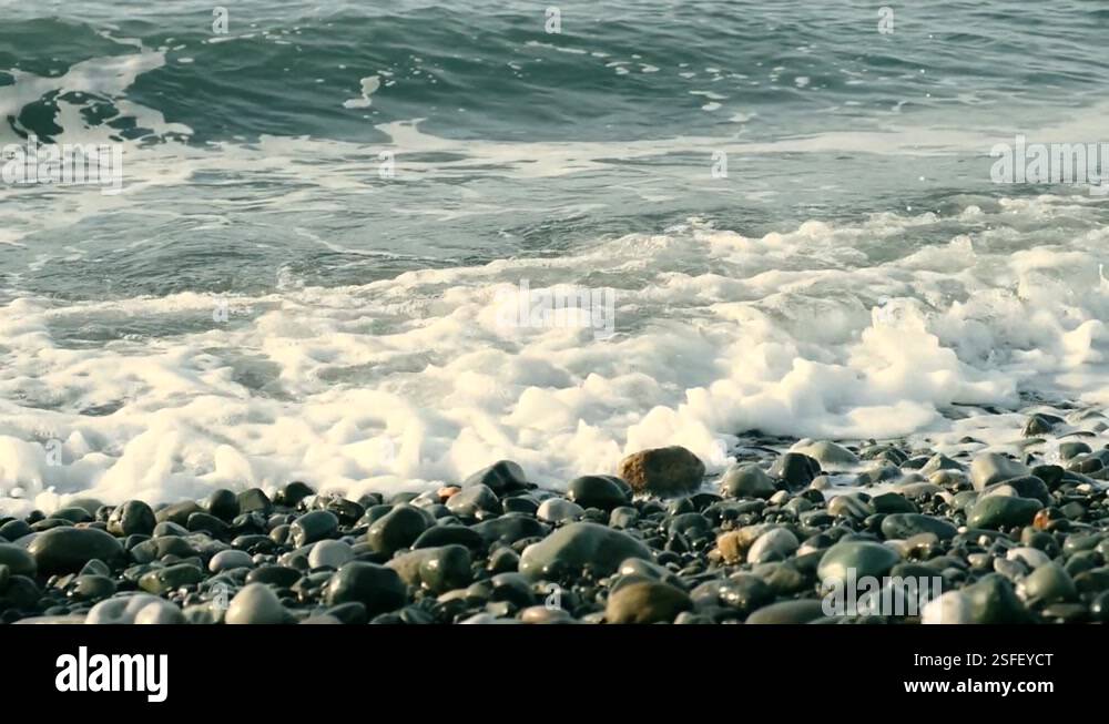 Sea Waves On Beach Pebbles, beautiful close-up footage of a sea waves ...