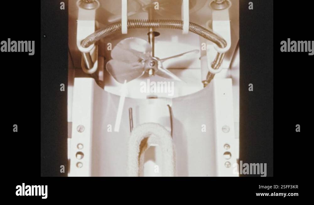 1960s: Fan and coil inside machine. Cabinet with knobs and dial. Metal ...