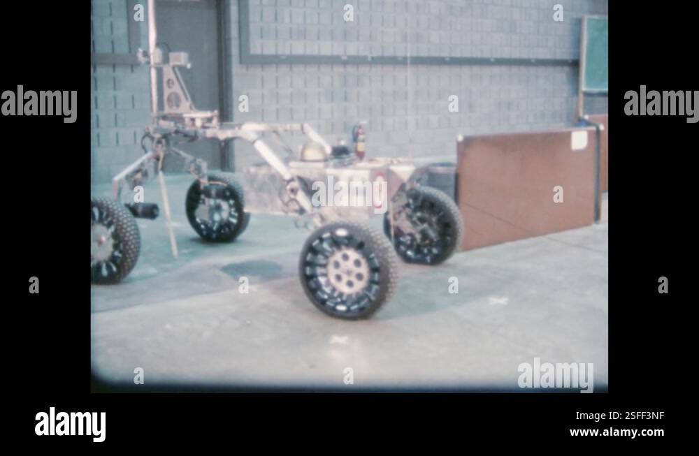 1970s: Robotic vehicle traverses obstacle course in warehouse Stock ...