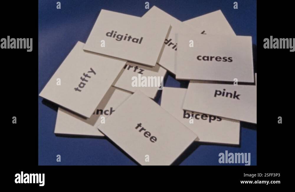 1960s: Hands tossing notecards into pile. Pile of cards. Text on cards ...