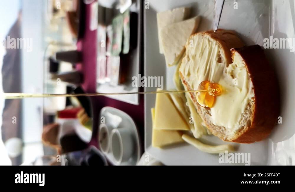 Morning breakfast with spreading sweet honey on toast with butter ...