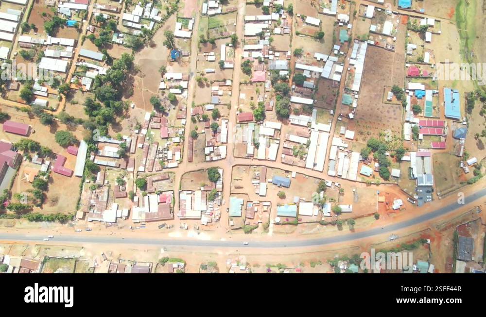 urban setting with unassuming buildings and poor roads in Kenya, Africa ...