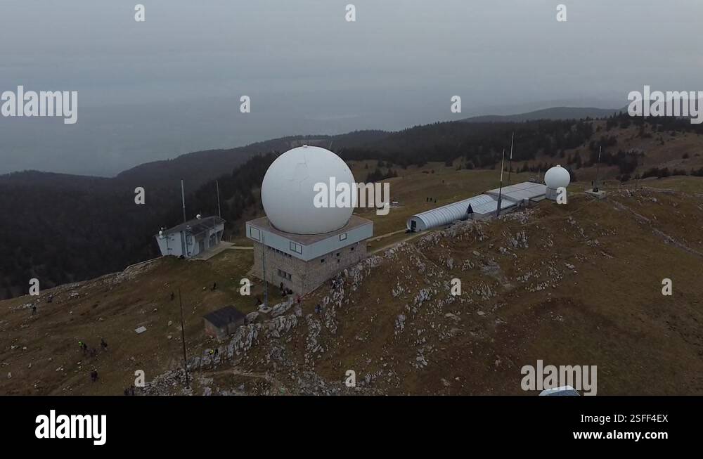 Drone Shot (moving back and rotating) of a Radar Station on top of a ...