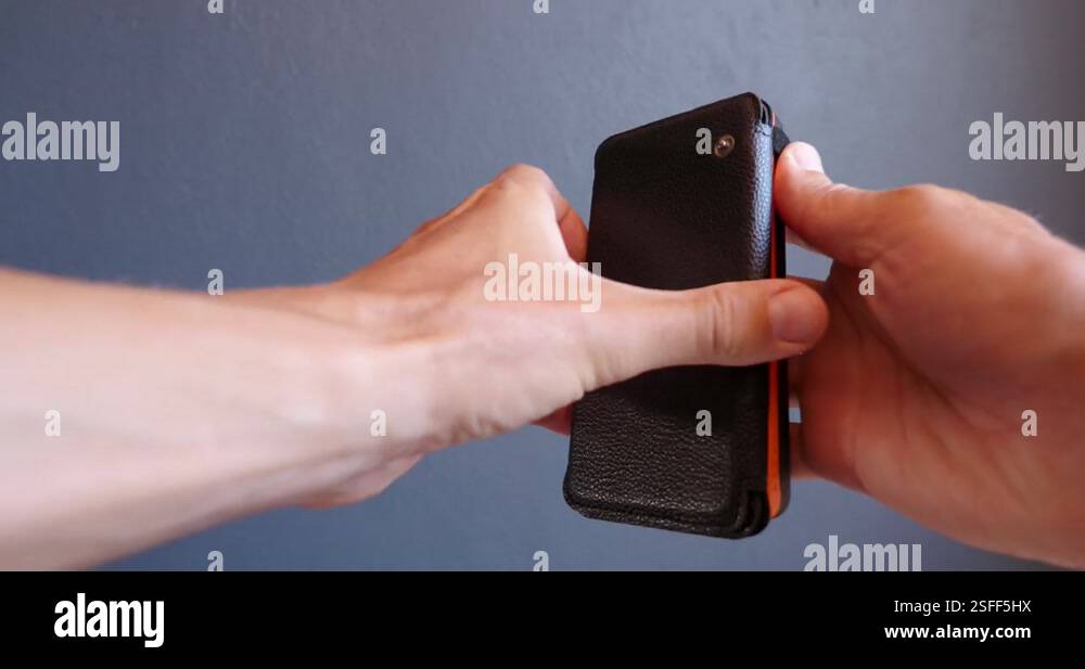 Hands unfolding portable power bank with solar panel. POV Stock Video ...