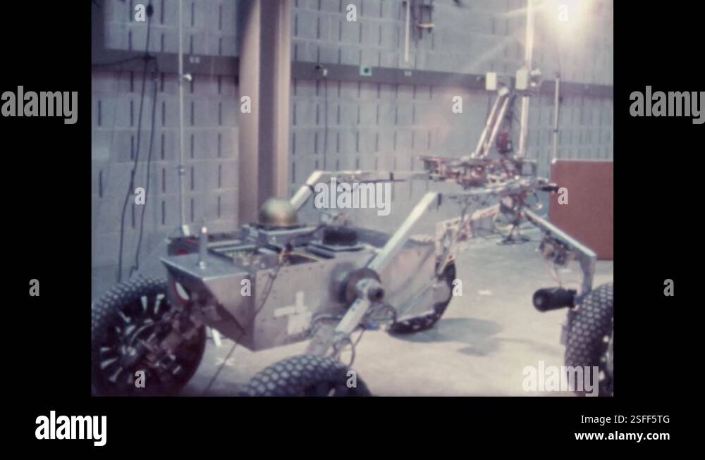 1970s: Cables of rover being connected. Mars rover driving through ...