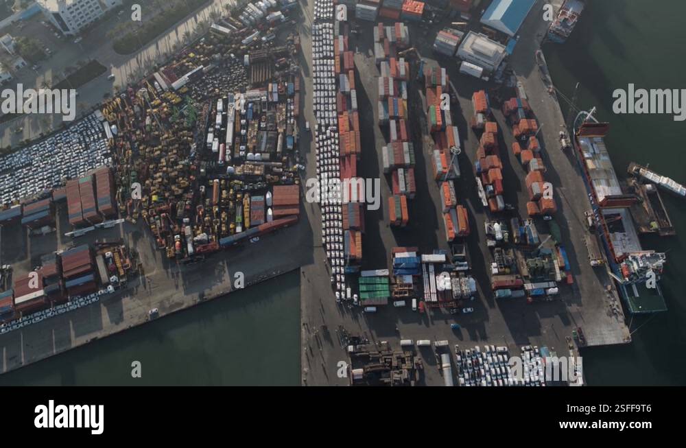 Video in a port showing cargo ship, containers on the quayside and new ...