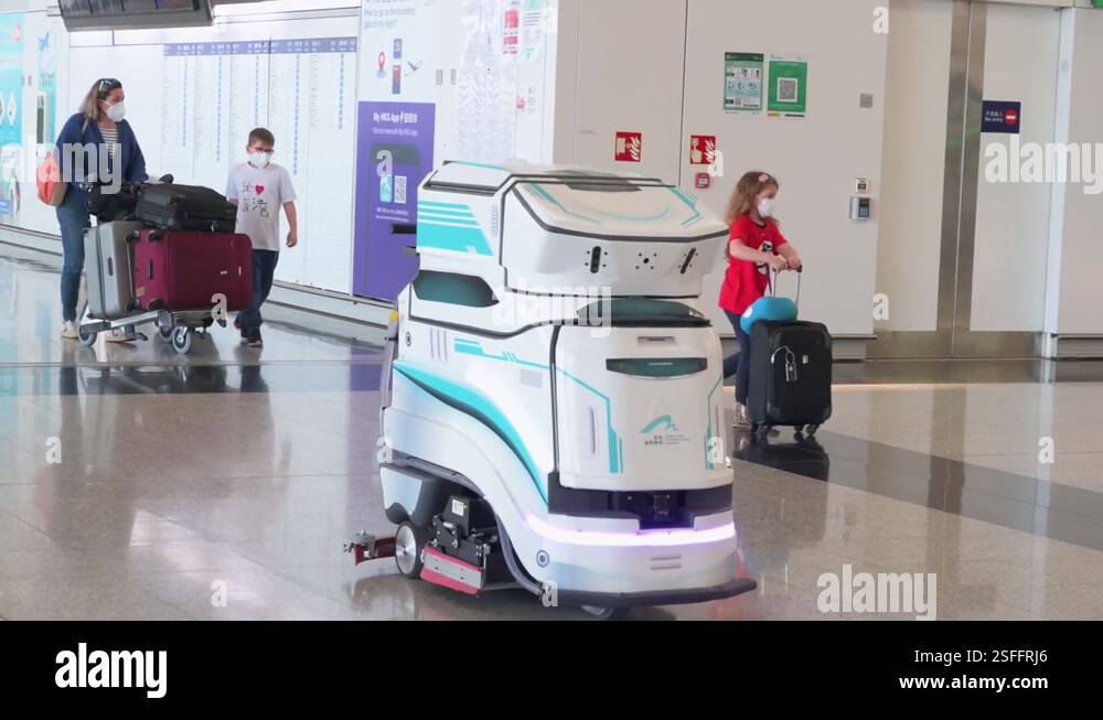 An autonomous disinfecting and cleaning machine is seen mopping the ...