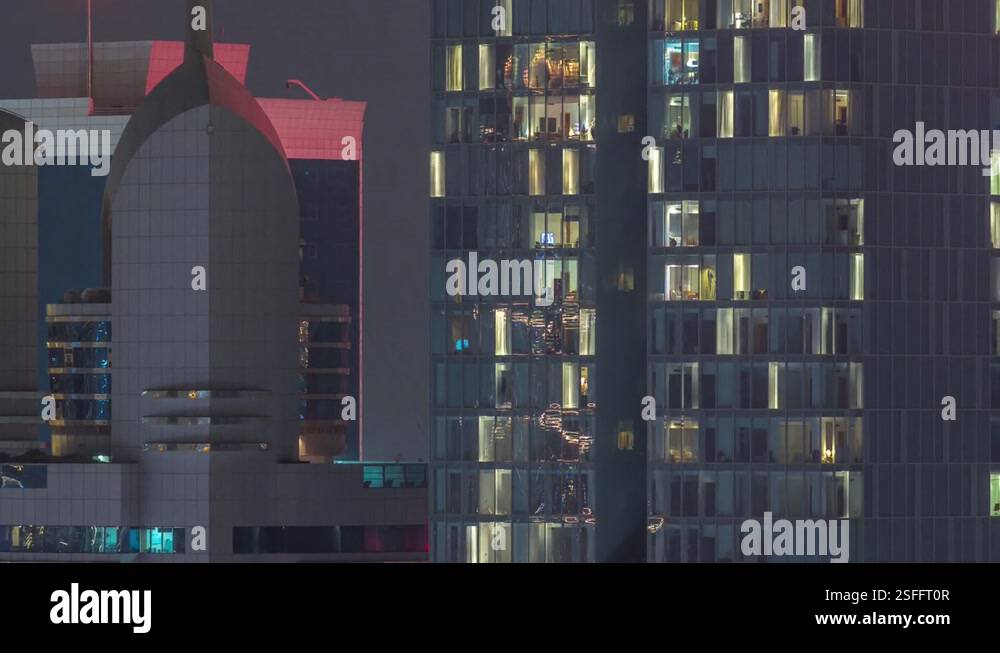Windows in high-rise building exterior in the late evening with ...