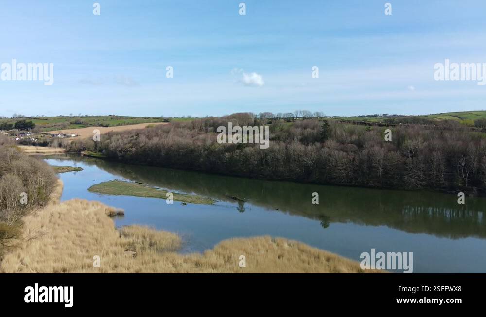 Slow flowing, tidal river Bandon in West Cork, Ireland with wild banks ...
