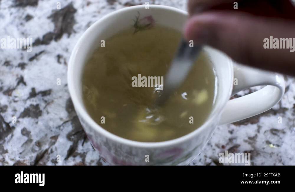 Hand Using Metal Spoon Stirring Ginger Honey Lemon Hot Drink. Close Up ...