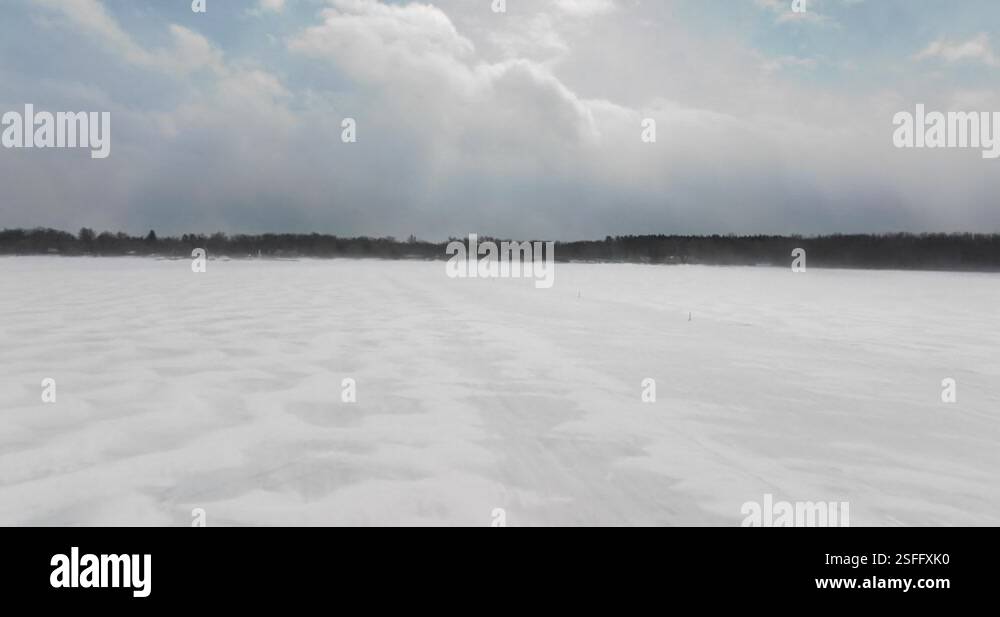 Flying above the frozen lake in Canada, Drone, windy weather, in 4k ...
